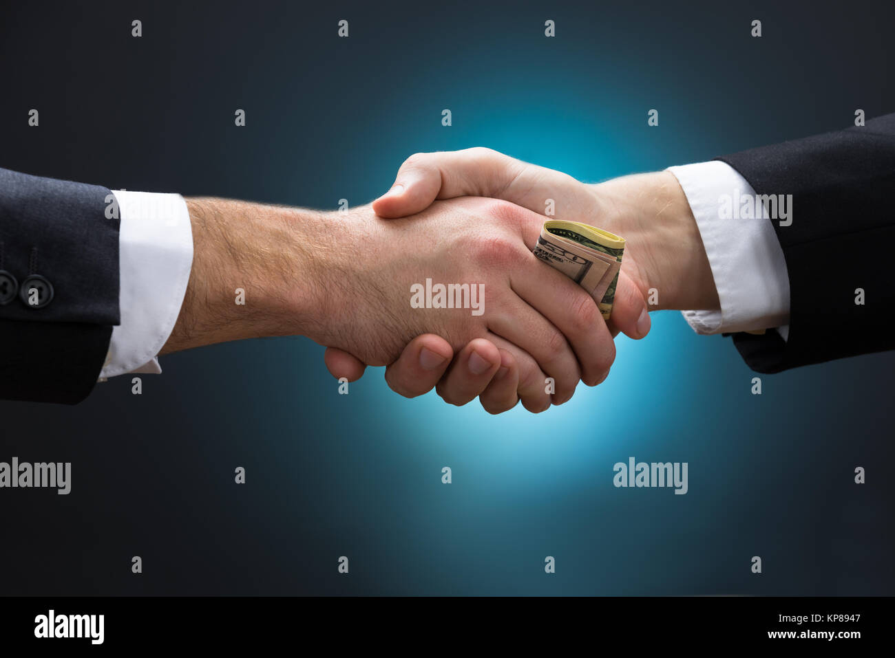 Businessman Shaking Hands While Giving Bribe To Partner Stock Photo - Alamy
