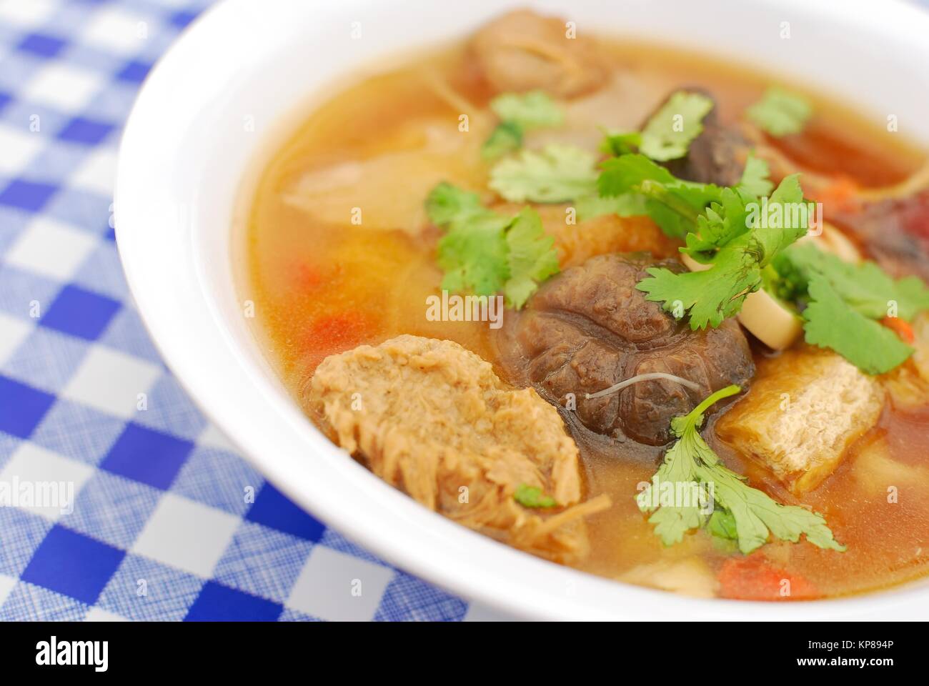 Sumptuous looking Chinese style broth with mushrooms,mock meat and ...
