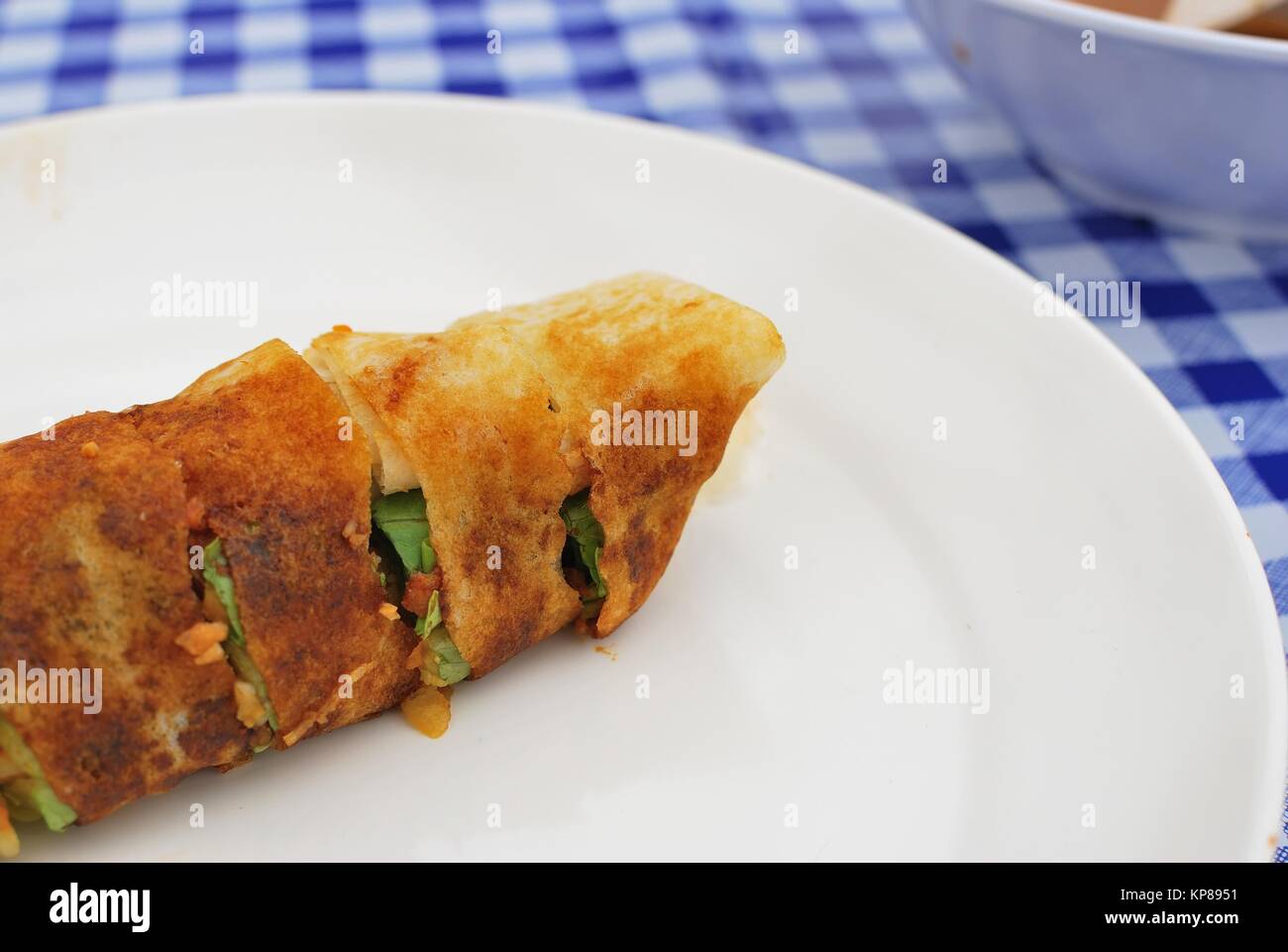Chinese style spring roll or crepe made from flour with fillings ...