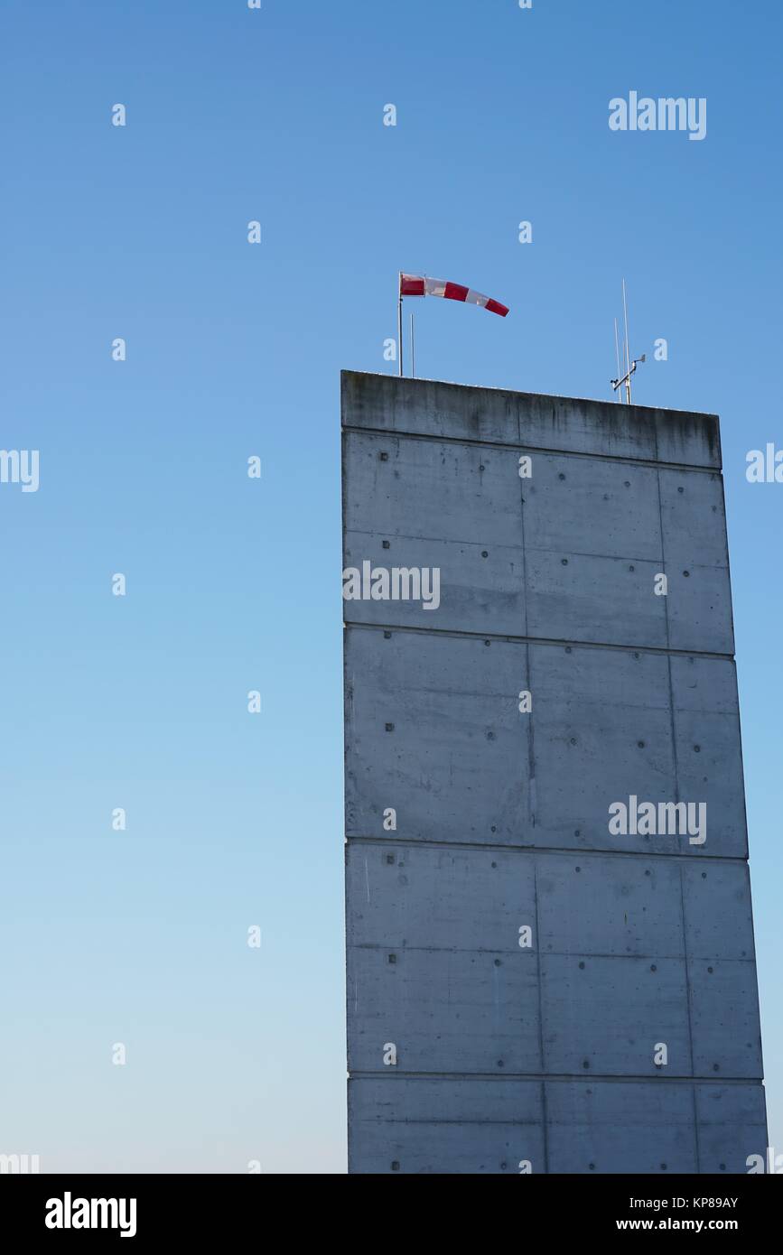 wind flag on a concrete pillar Stock Photo - Alamy