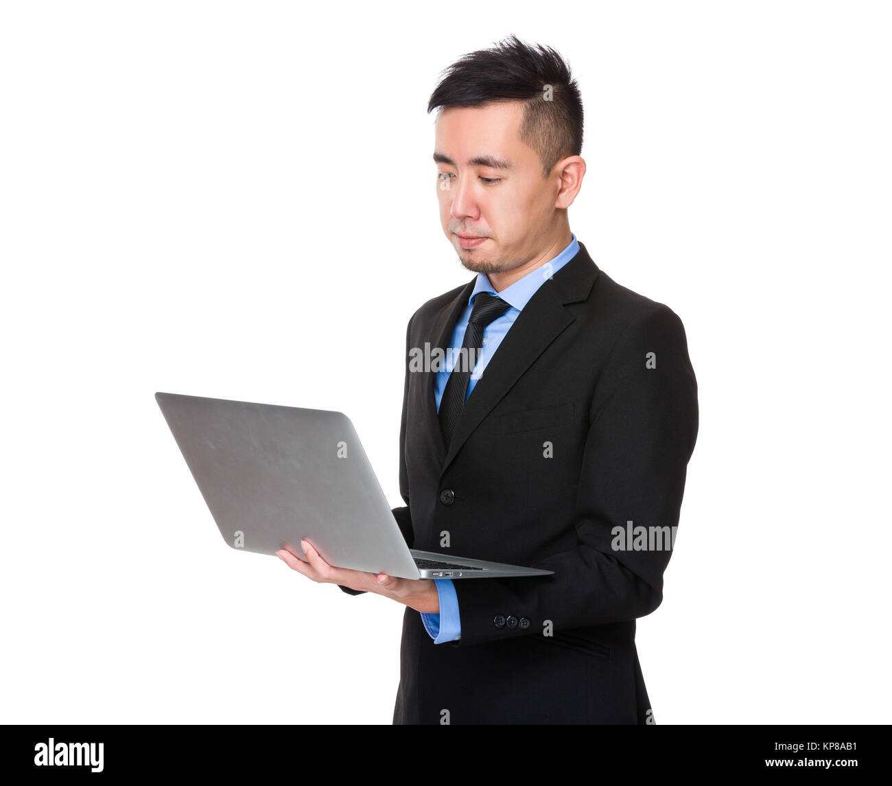 Young Businessman read on the notebook computer Stock Photo - Alamy