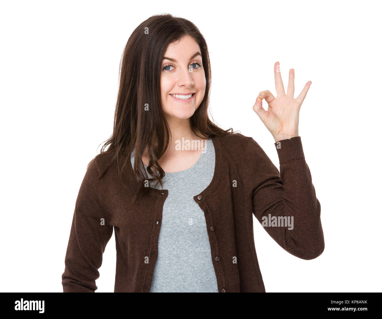 Young woman with ok sign gesture Stock Photo - Alamy