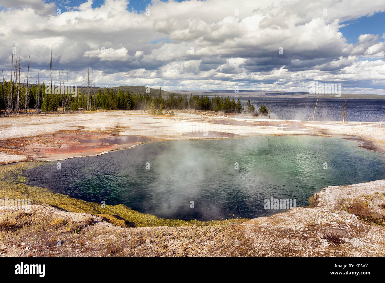 Thermal pool with Yellowstone Lake in background. Yellowstone National ...