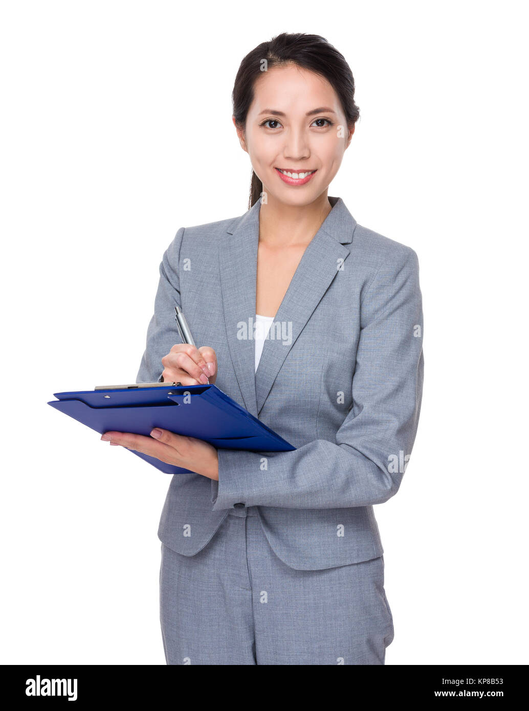 Asian Young Businesswoman take note on clipboard Stock Photo - Alamy