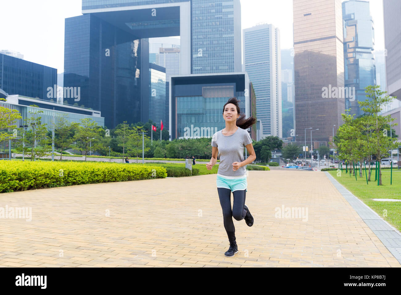 Woman running fast at Hong Kong Stock Photo - Alamy