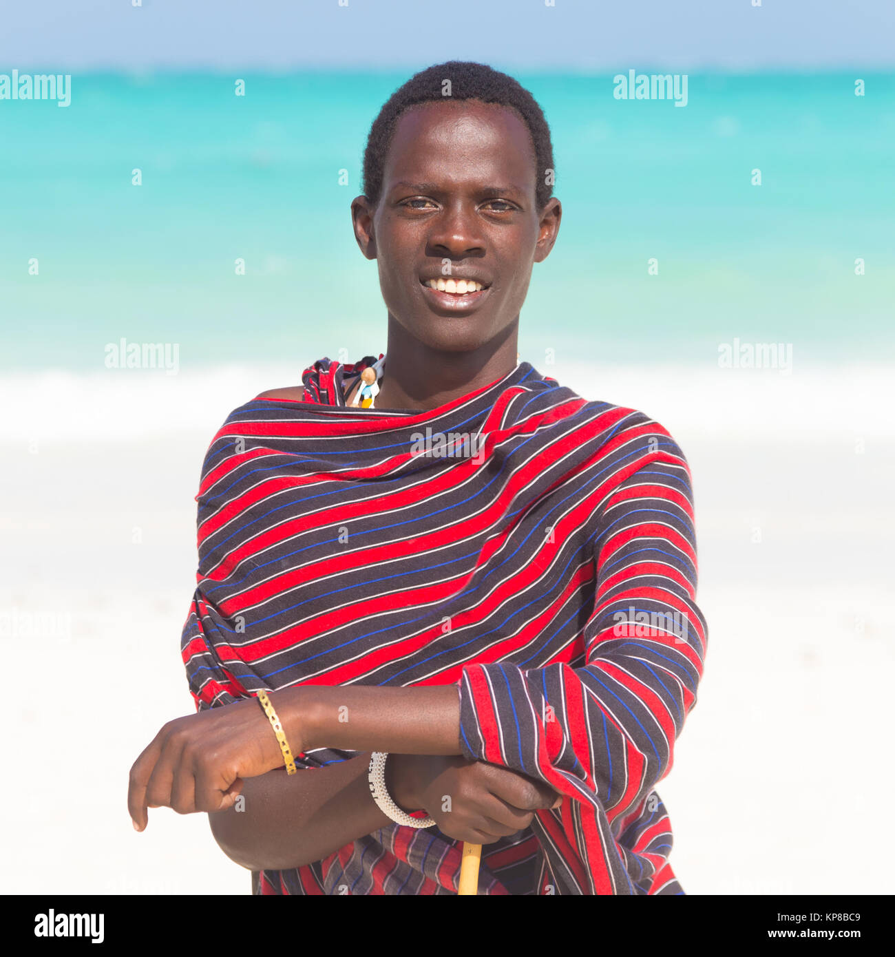 Traditonaly dressed black man on beach Stock Photo - Alamy