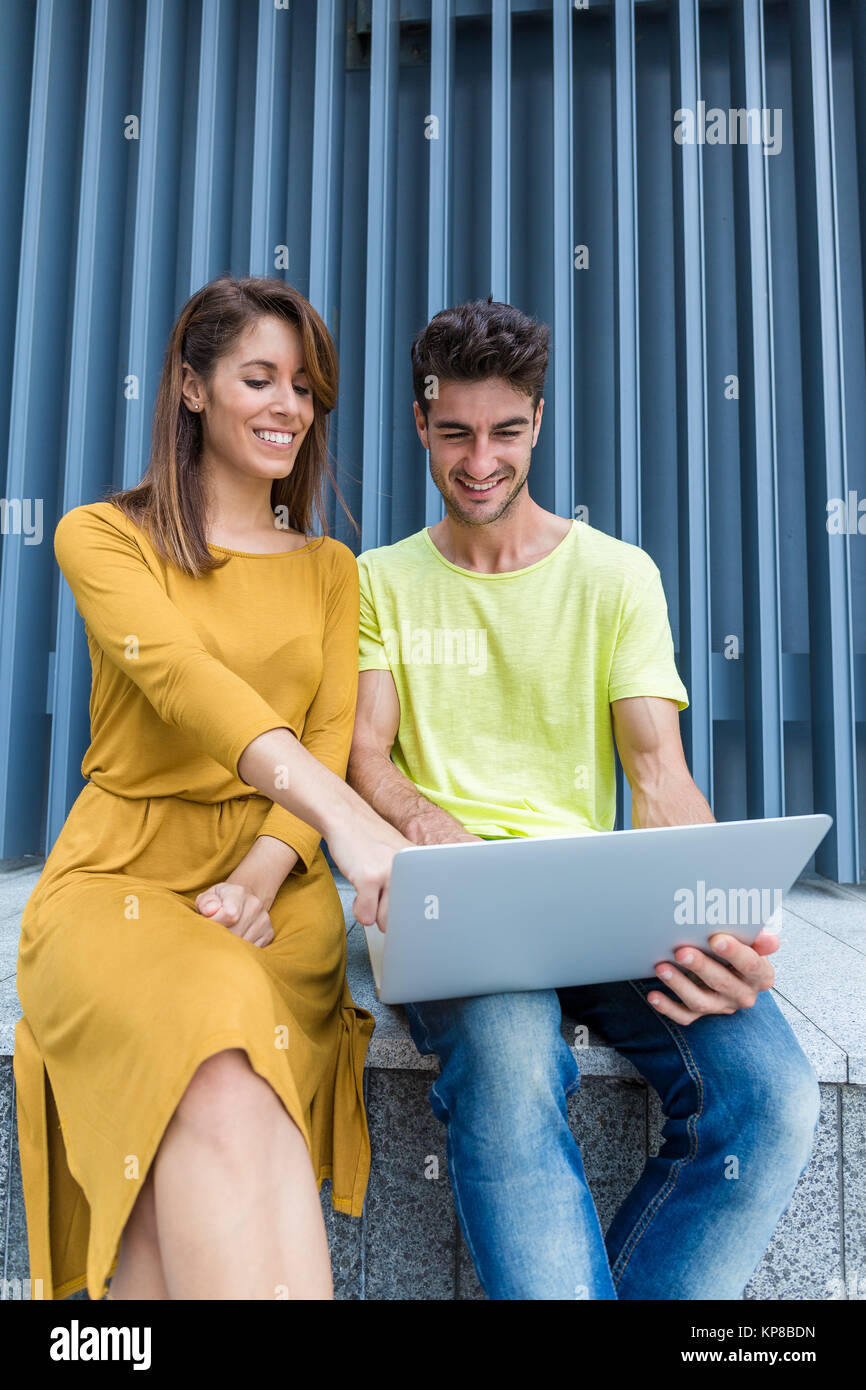 Caucasian couple use of the notebook computer together Stock Photo - Alamy