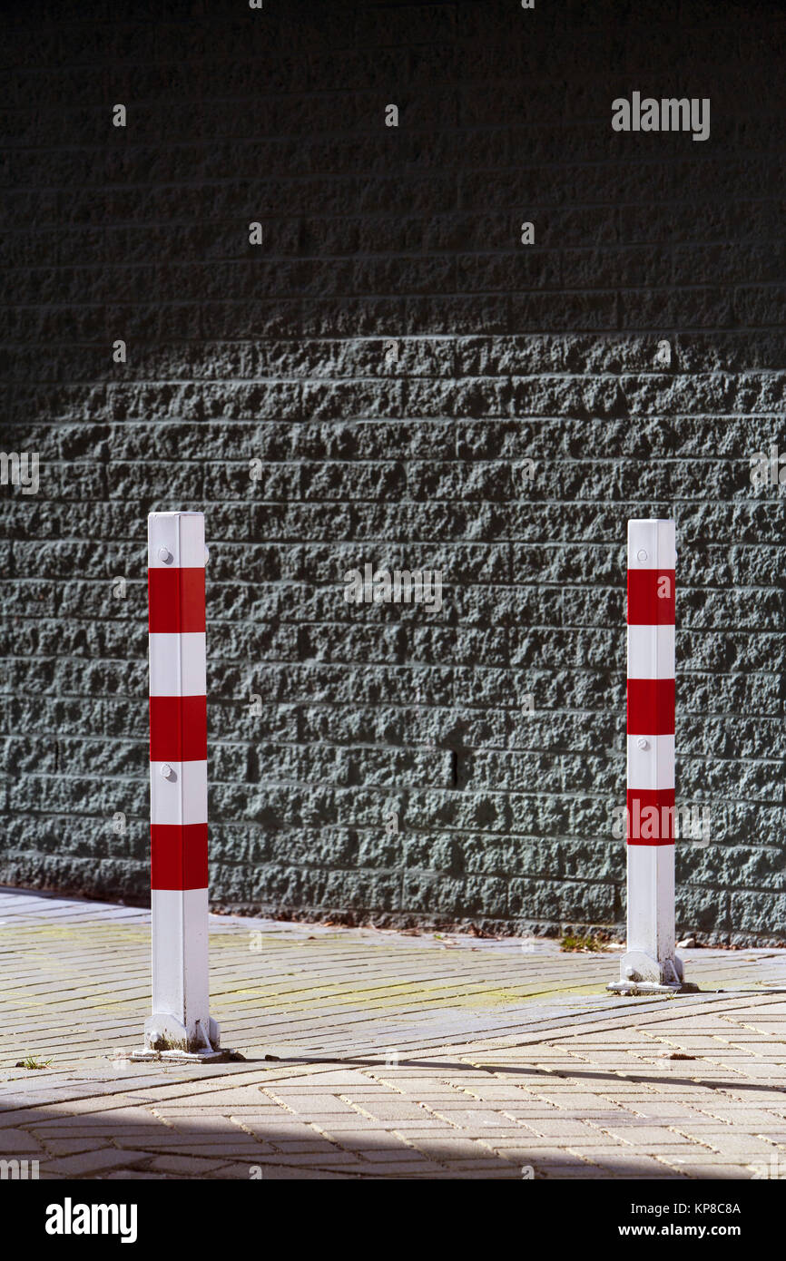 Red and white striped poles Stock Photo - Alamy