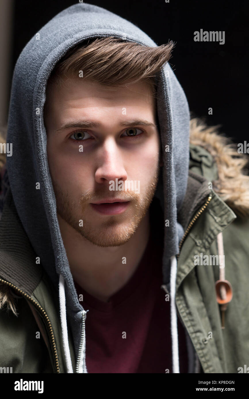 Portrait of a young man with his hood up Stock Photo - Alamy