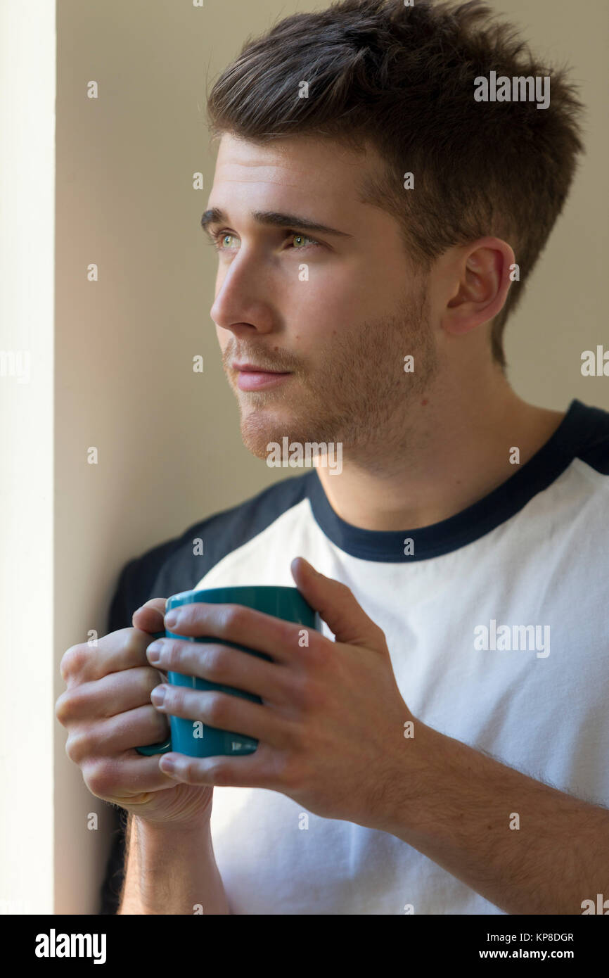 Portrait of a man drinking tea Stock Photo - Alamy