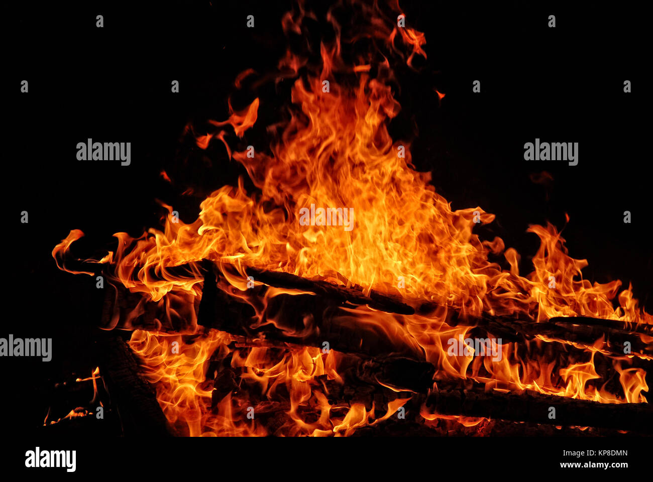 Large campfire at night while camping Stock Photo - Alamy