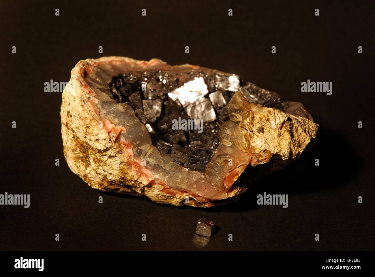 pyrite stone against black background Stock Photo - Alamy