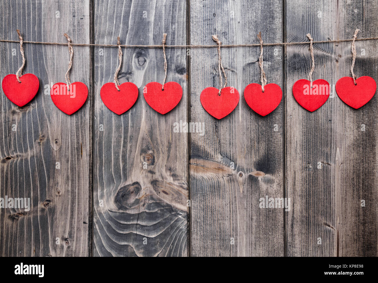 Love concept. Hearts hanging on a string Stock Photo - Alamy