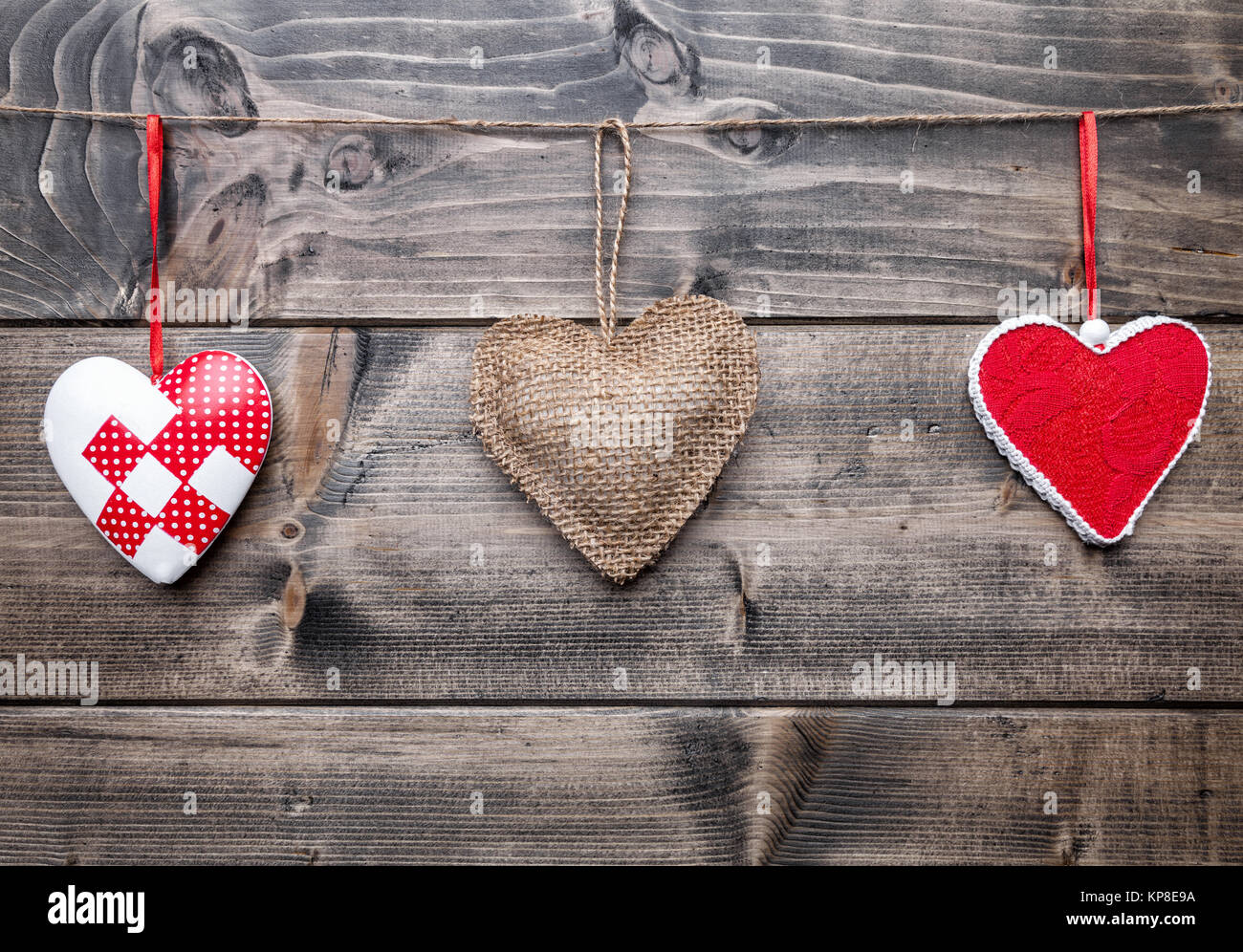 Love concept. Hearts hanging on a string Stock Photo - Alamy
