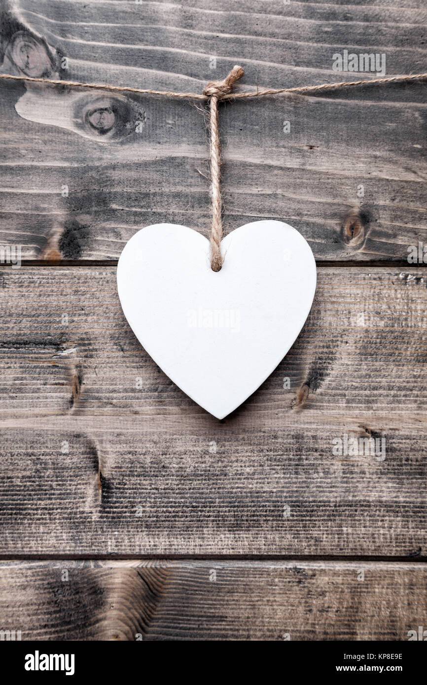 Love concept. Heart hanging on a string Stock Photo - Alamy