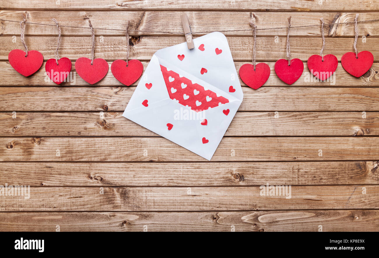 Love concept. Hearts and love letter hanging on a string Stock Photo ...