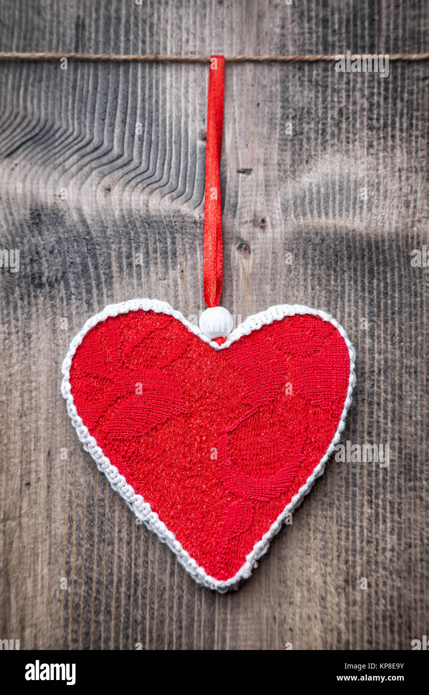 Love concept. Heart hanging on a string Stock Photo - Alamy
