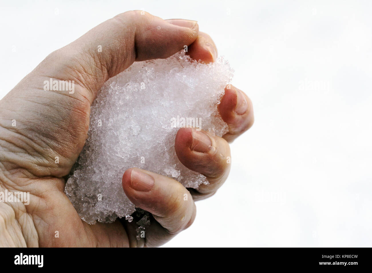Hold cold snow in your hand. Cold snow in hand Stock Photo - Alamy