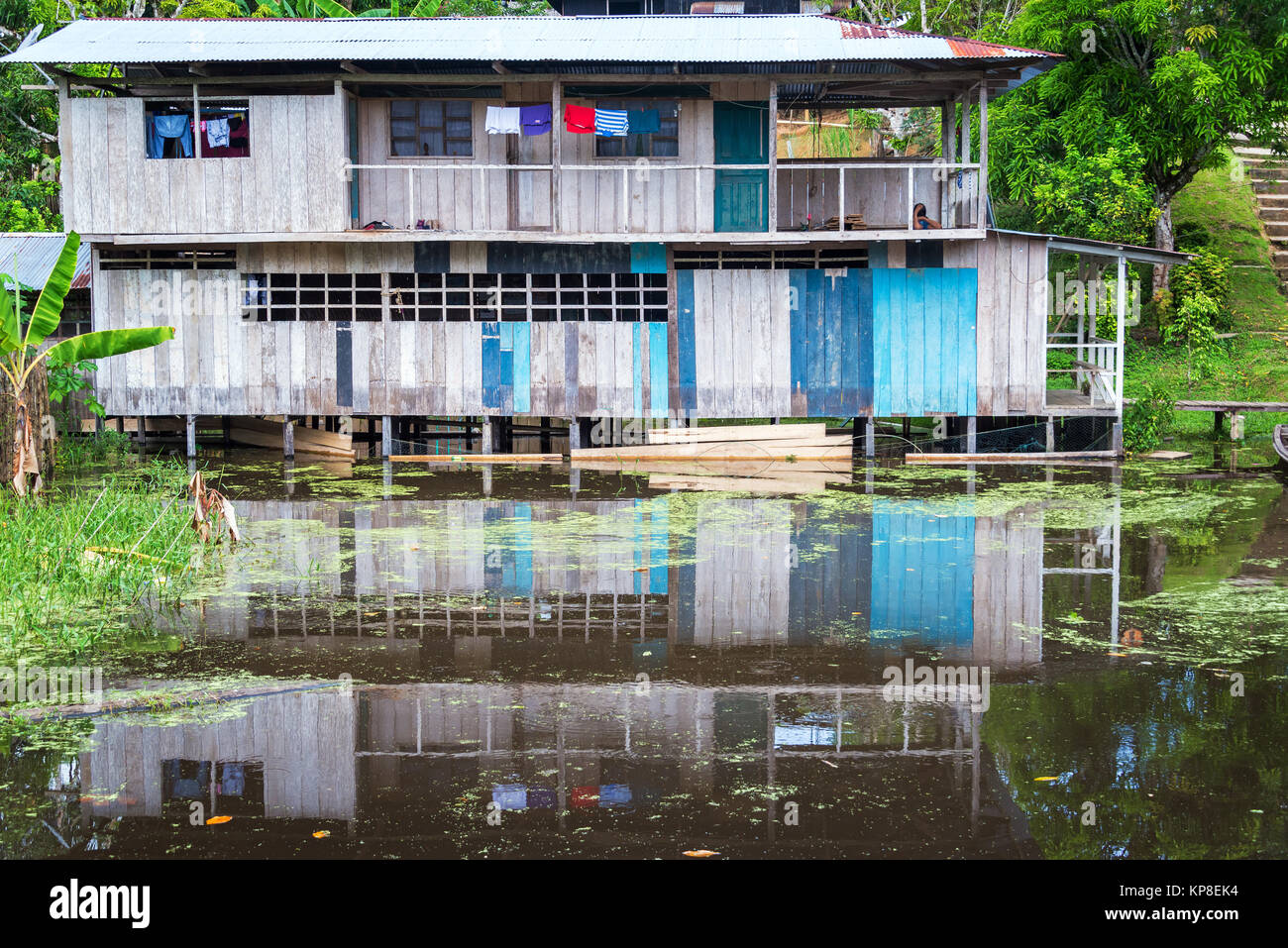 House Reflected in Amazon River Stock Photo - Alamy