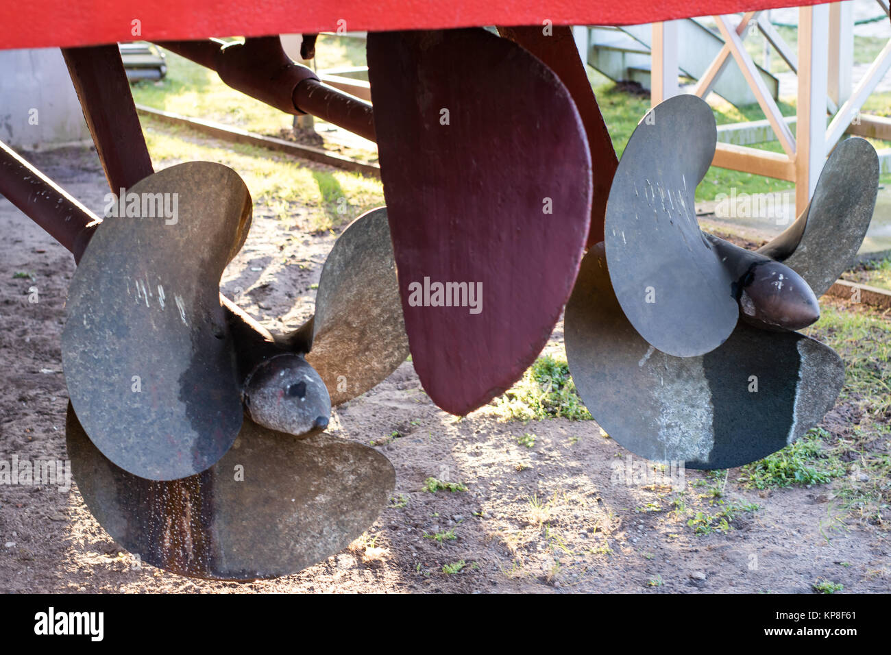 The screw of a fishing boat exhibited in a port workshop. Repair of ...