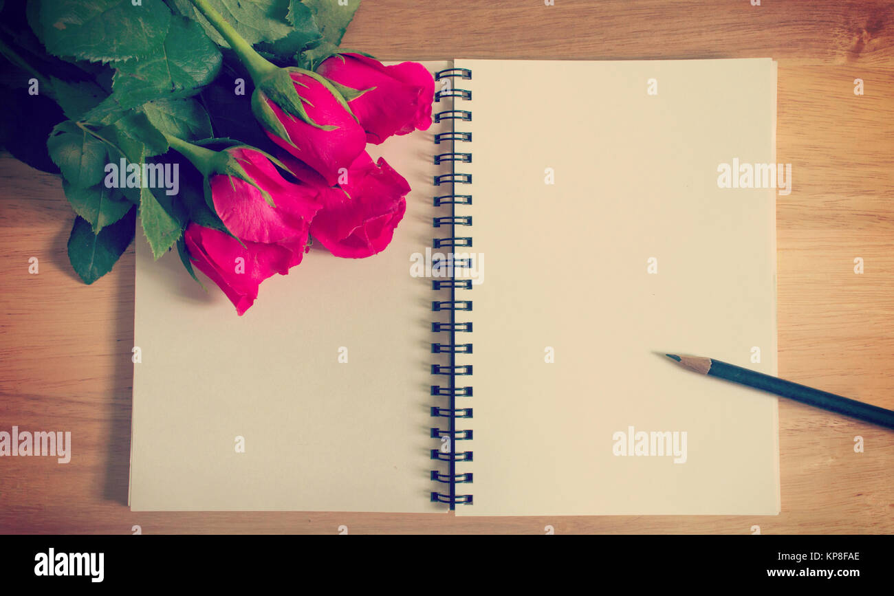 Vintage,retro of note book paper and pencil with rose Stock Photo - Alamy