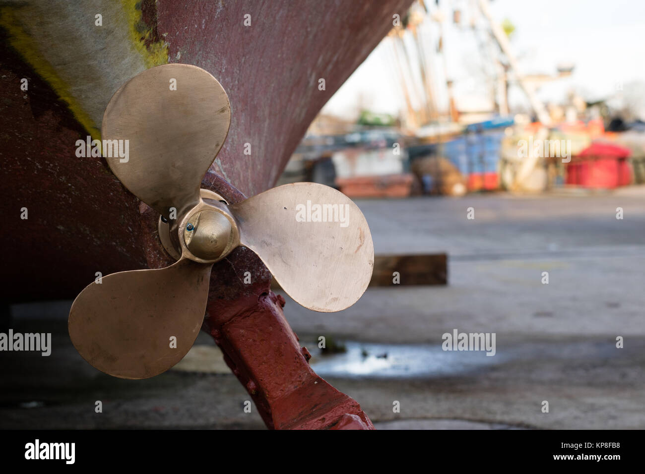 The screw of a fishing boat exhibited in a port workshop. Repair of ...