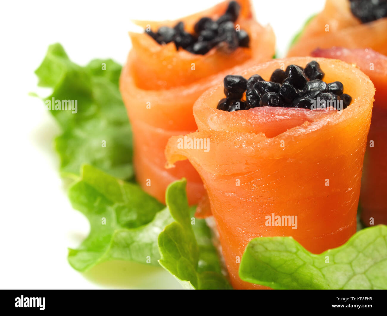 Salmon rolls with caviar Stock Photo - Alamy
