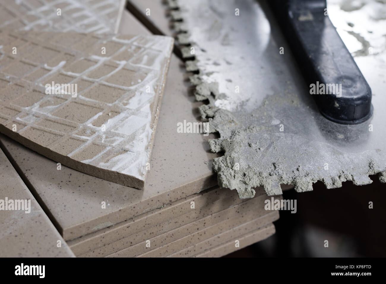 Cut tiles on the floor stacked. Tiles and masonry rugs for laying tiles ...
