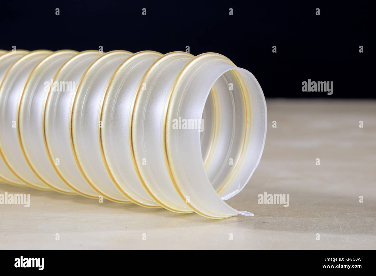 Technical hoses on a wooden table. Cables for use in factories and ...