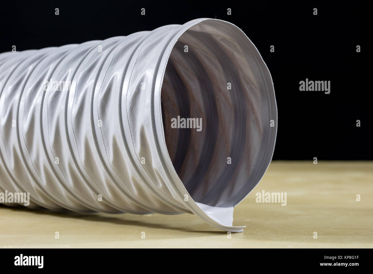 Technical hoses on a wooden table. Cables for use in factories and ...