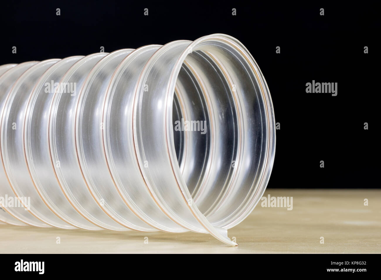 Technical hoses on a wooden table. Cables for use in factories and ...
