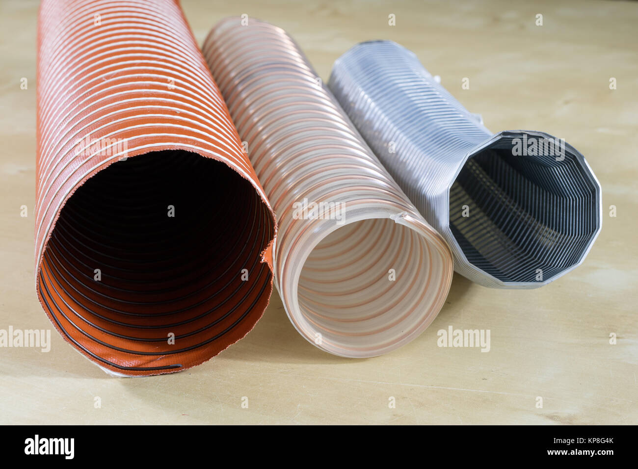 Technical hoses on a wooden table. Cables for use in factories and ...