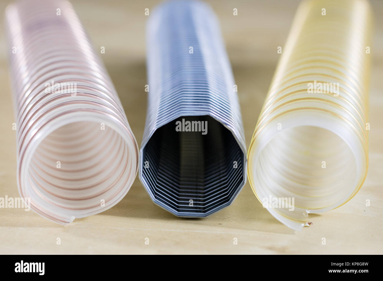 Technical hoses on a wooden table. Cables for use in factories and ...
