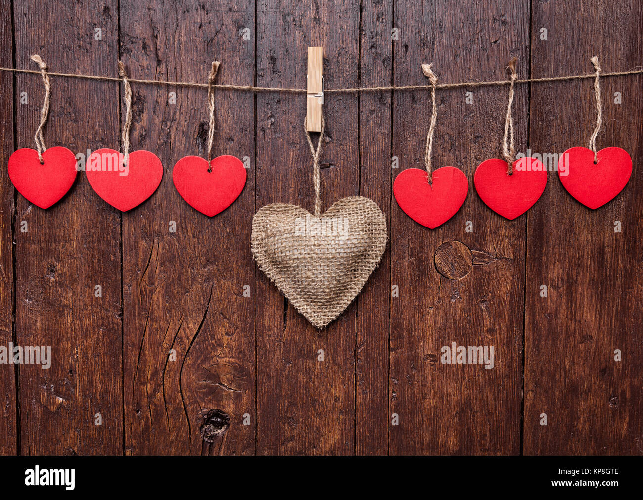Love concept. Hearts hanging on a string Stock Photo - Alamy