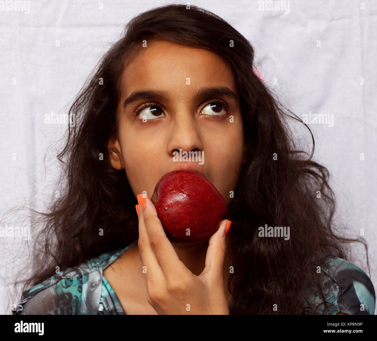 Girl child eating apple Stock Photo - Alamy