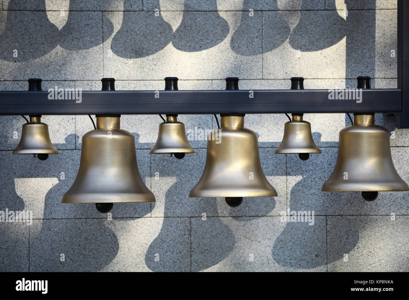 Various bells in a row Stock Photo - Alamy