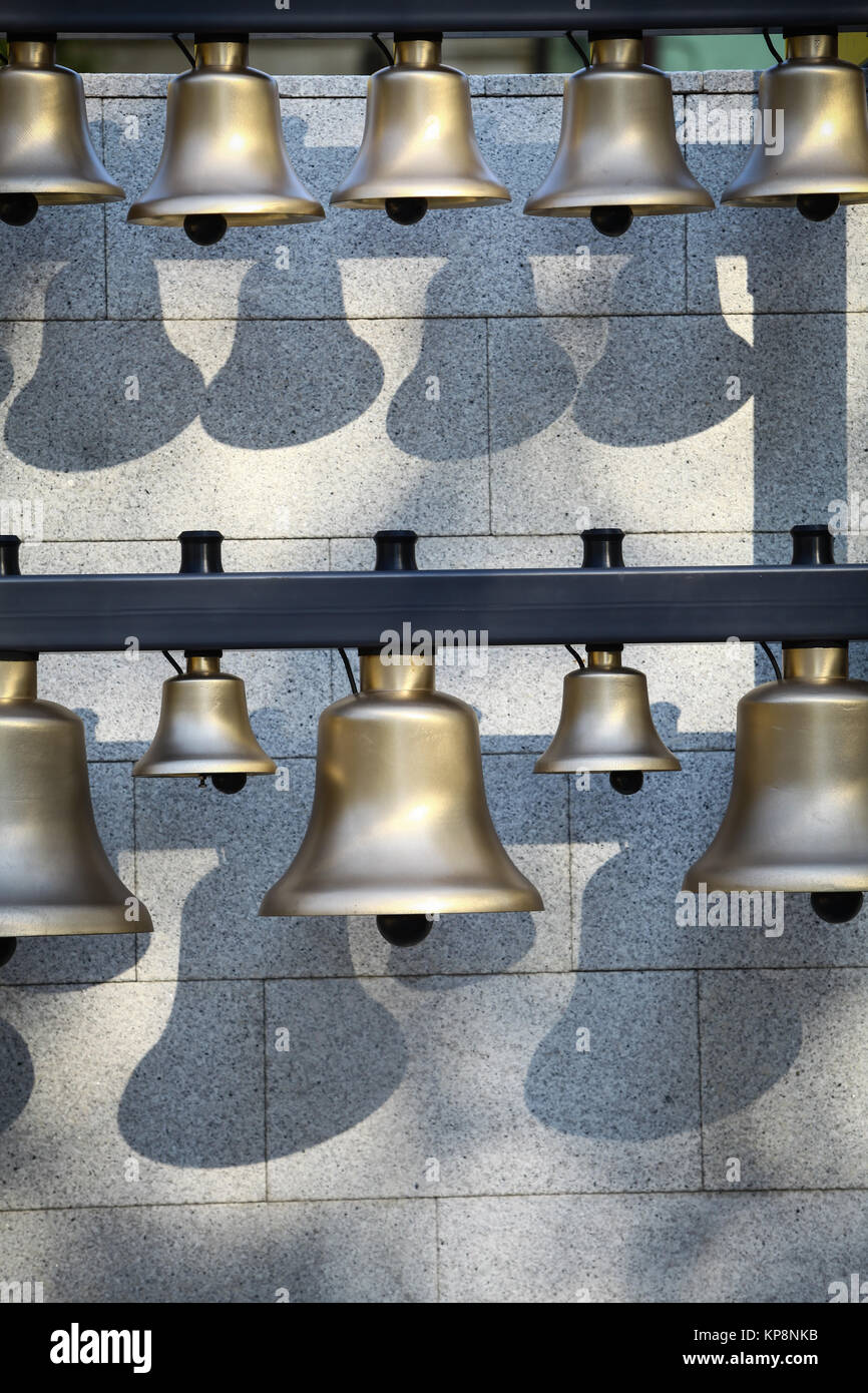 Various bells in a row Stock Photo - Alamy