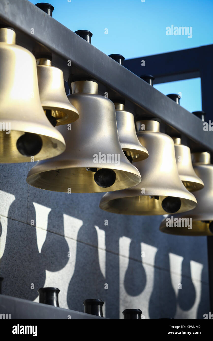 Various bells in a row Stock Photo - Alamy