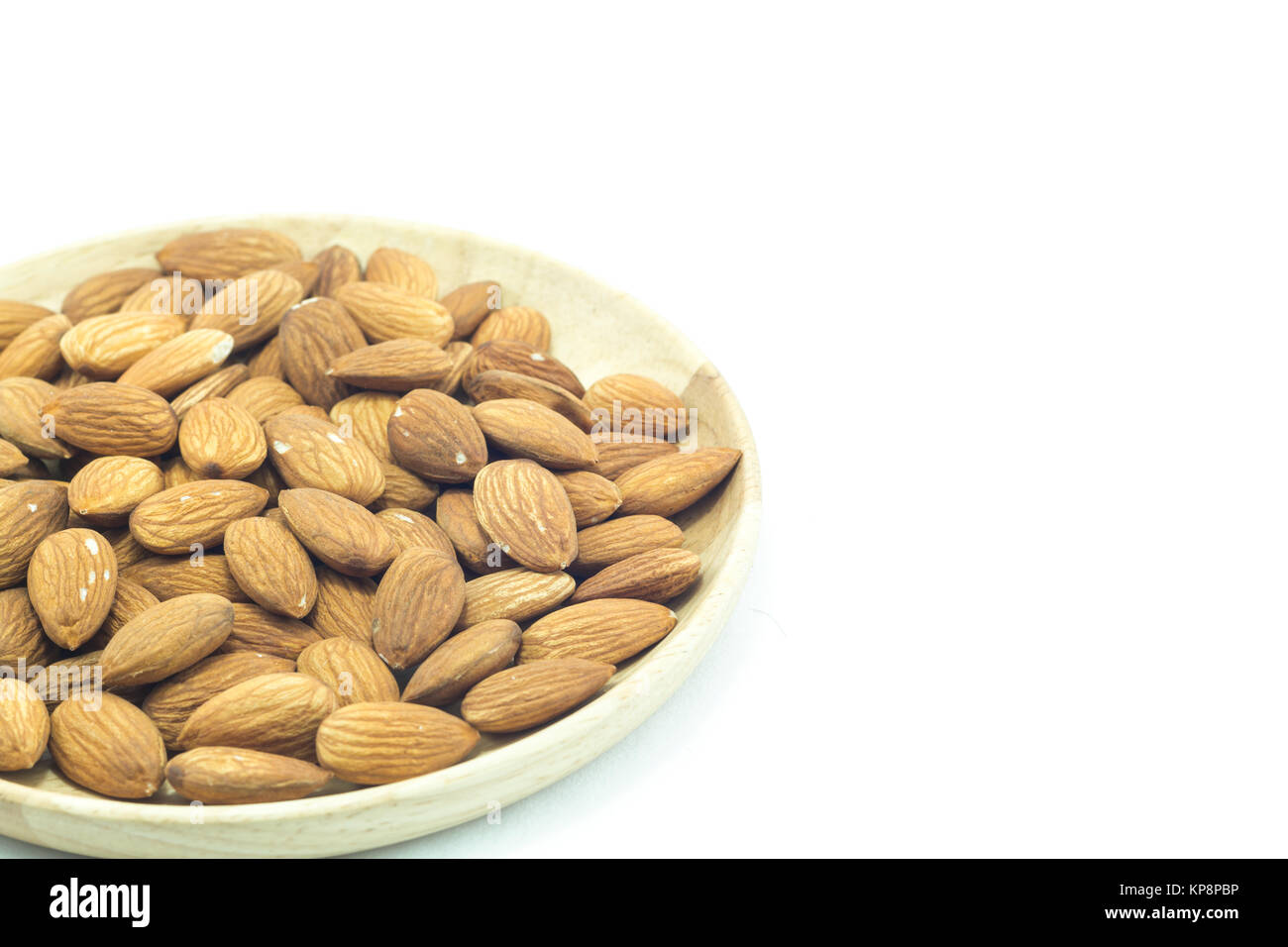 Plate of almond isolated on white background Stock Photo - Alamy