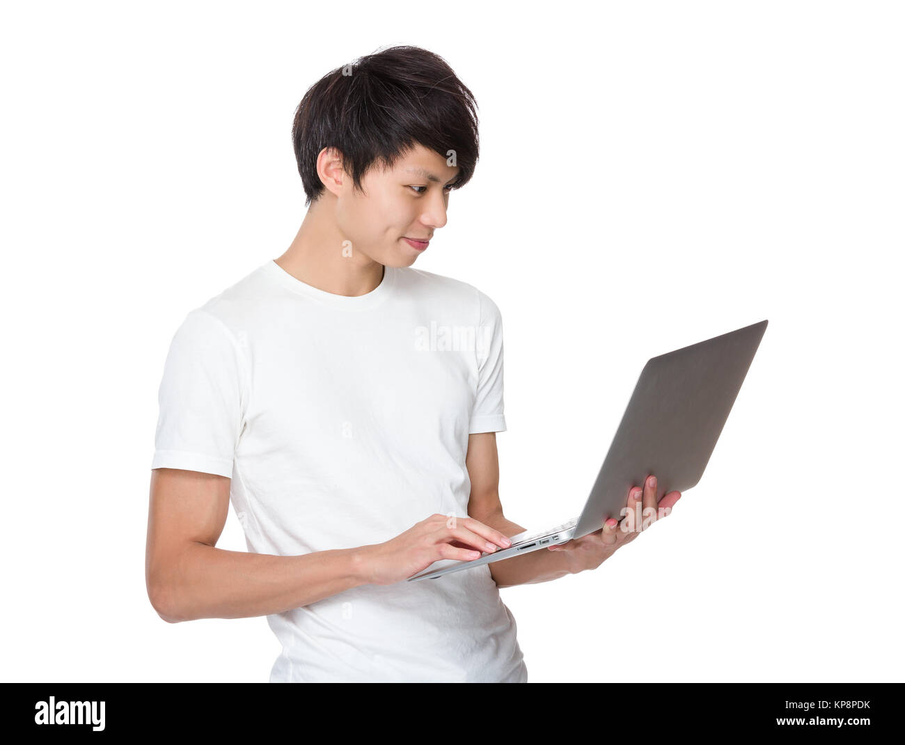 Asian young man use of the notebook computer Stock Photo - Alamy