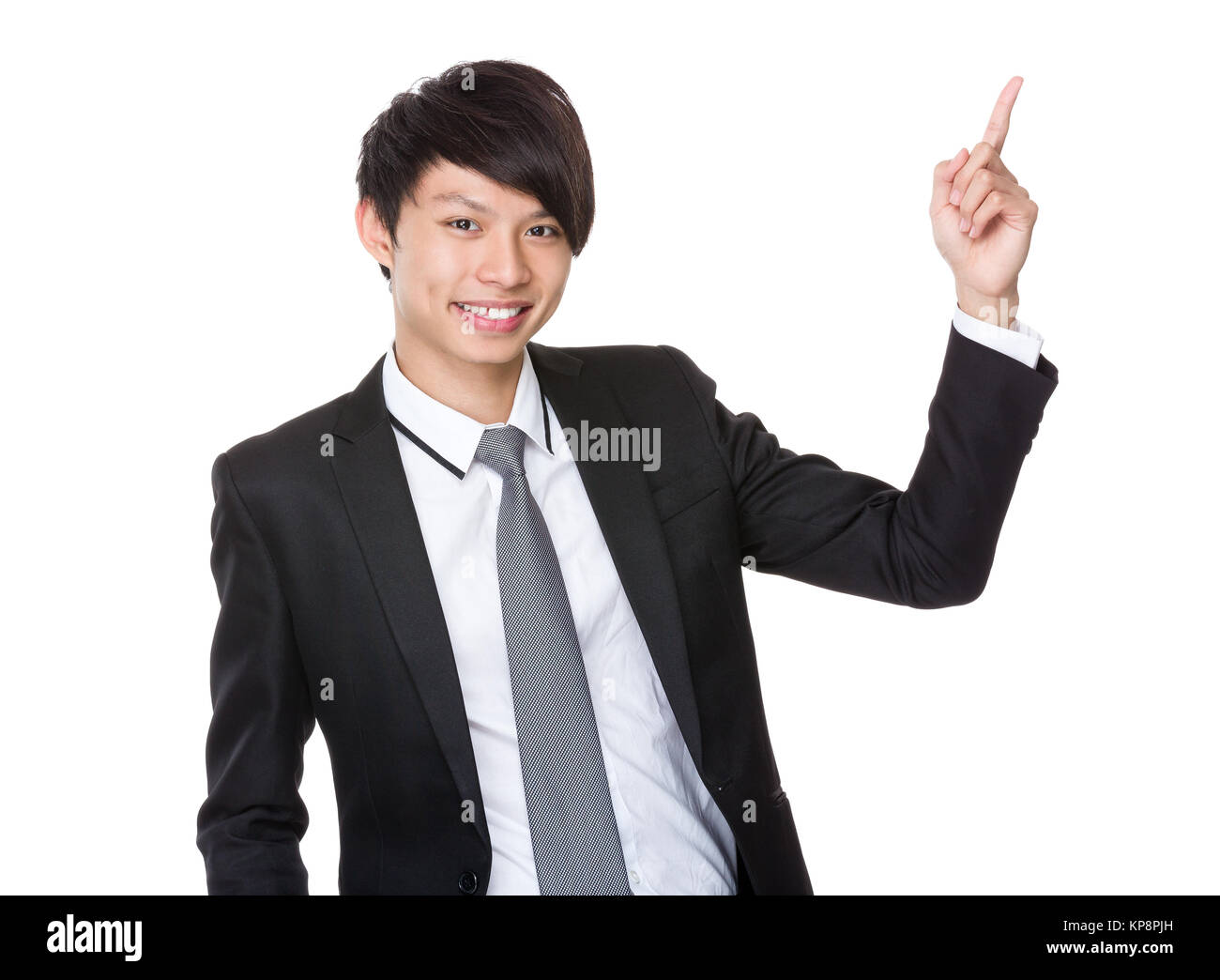 Young businessman with finger point up Stock Photo - Alamy