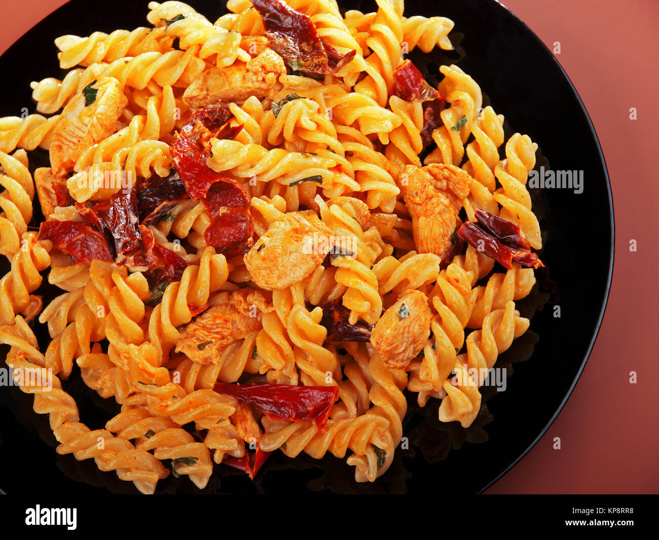 Fusilli with chicken and dried tomatoes,Fusilli with chicken and dried ...