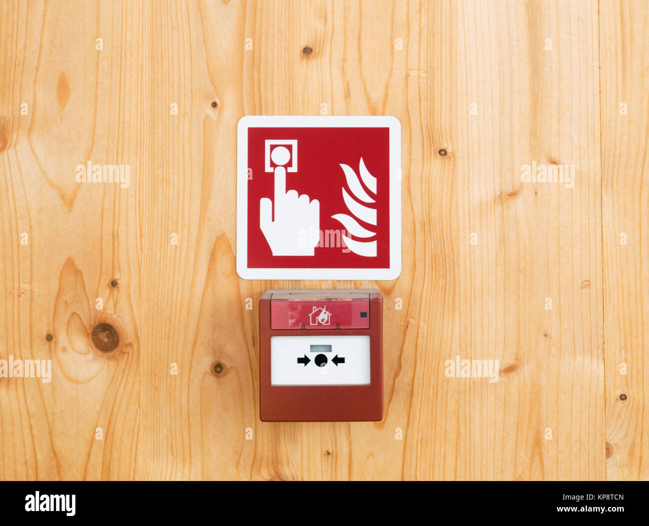 sign and fire alarm button mounted on wooden wall Stock Photo - Alamy