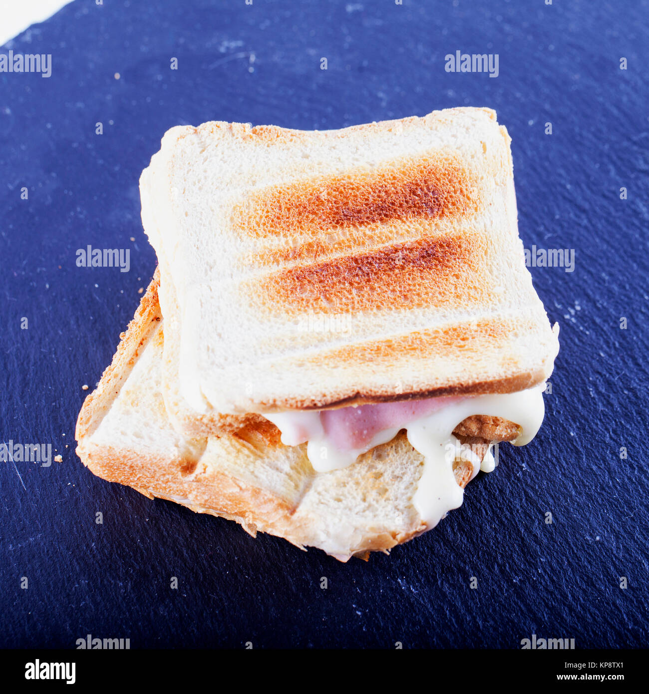 Toast over black stone plate Stock Photo - Alamy