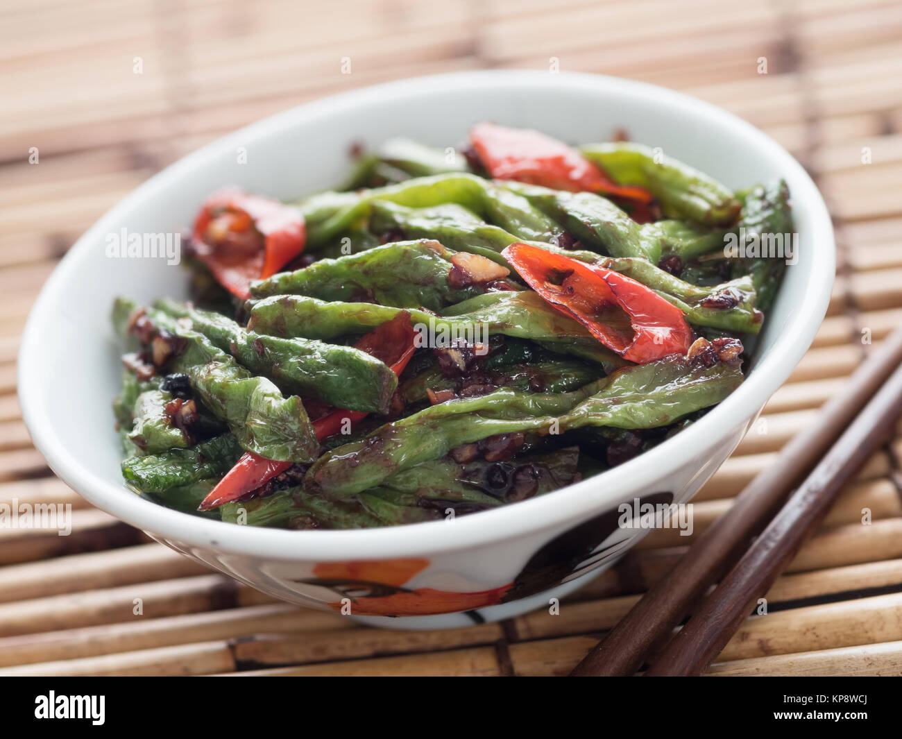 rustic chinese long snake bean stir fry Stock Photo - Alamy