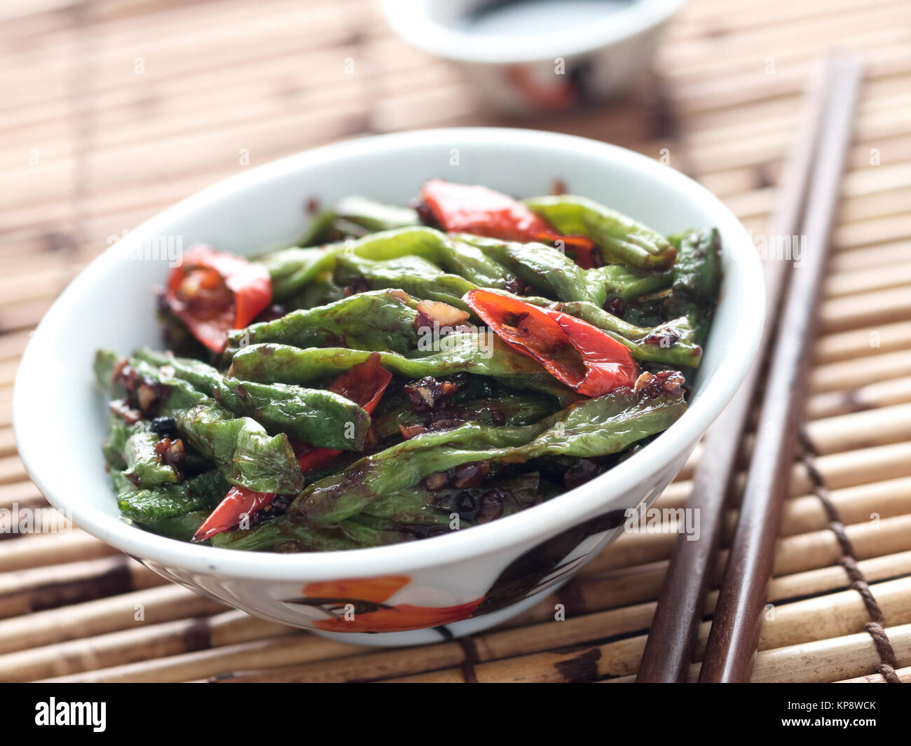 rustic chinese long snake bean stir fry Stock Photo - Alamy