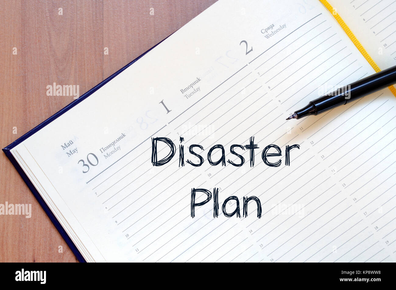 Disaster plan write on notebook Stock Photo - Alamy
