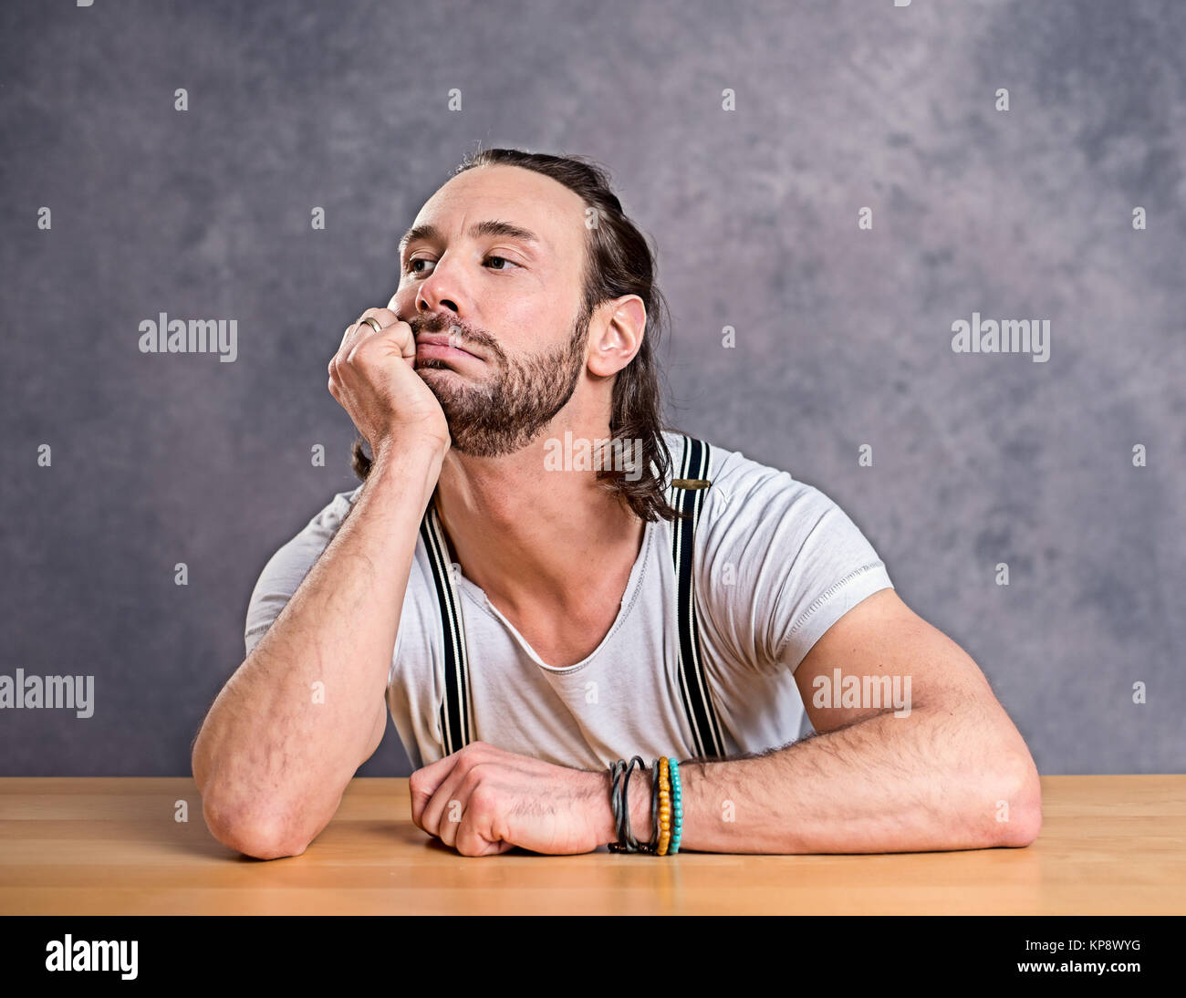 young man looking bored to the side Stock Photo - Alamy