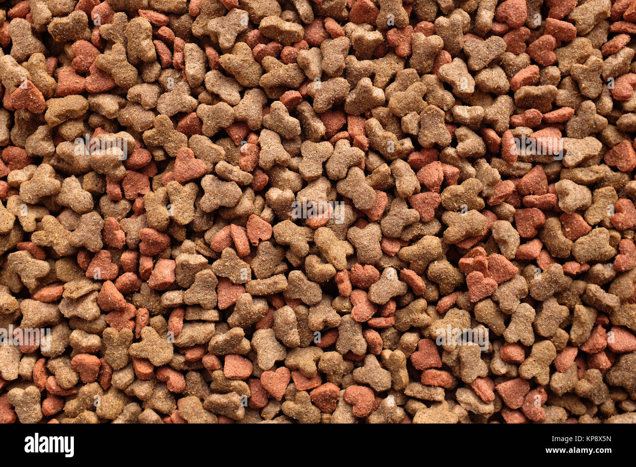 Dried cat food background Stock Photo - Alamy