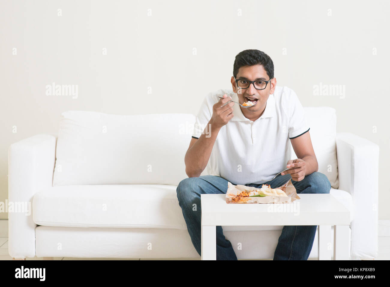 Lonely man eating food alone Stock Photo - Alamy